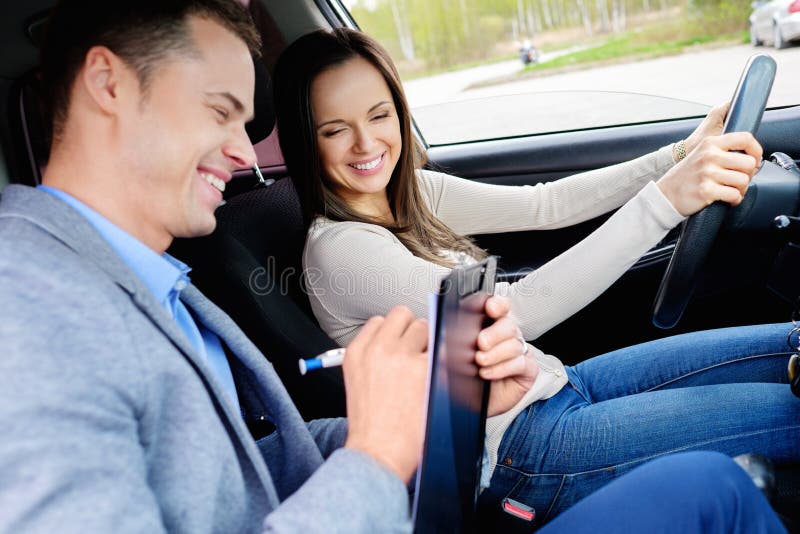 Driving Instructor and Woman Student Stock Photo - Image of ...