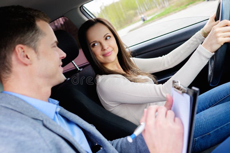 Driving Instructor and Woman Student Stock Photo - Image of talking ...
