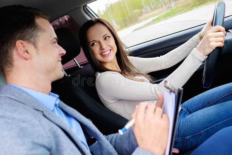 Driving Instructor and Woman Student Stock Photo - Image of ...