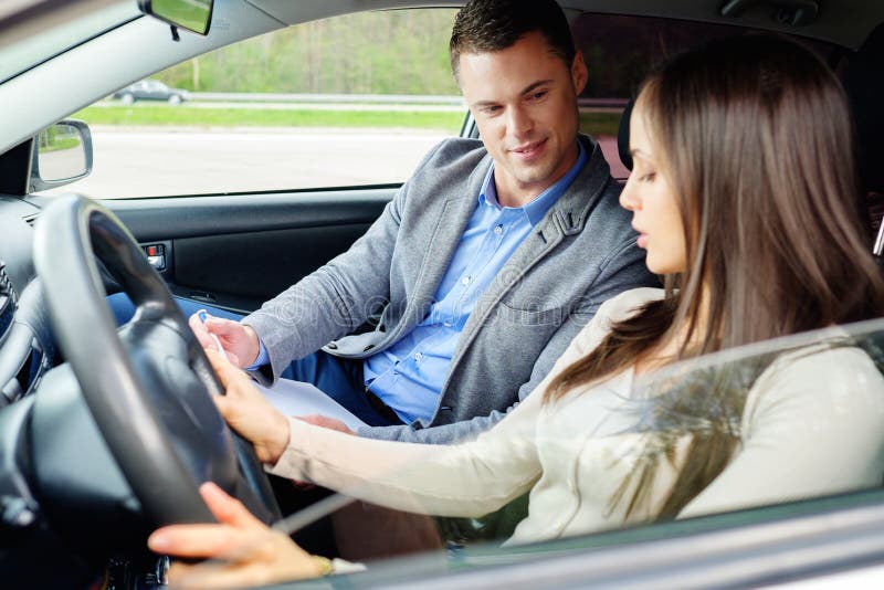 Driving Instructor and Woman Student Stock Image - Image of talking ...