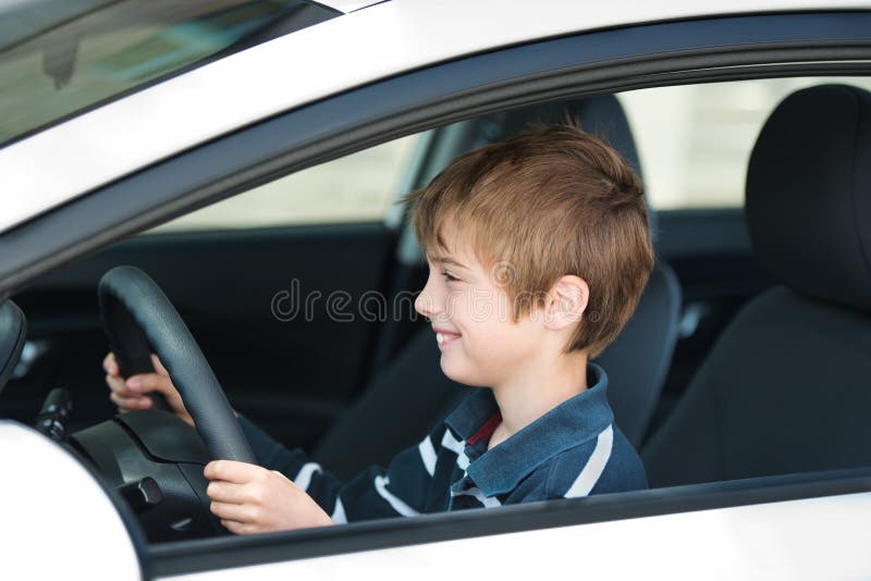 Driving little boy stock photo. Image of automobile, beaming - 31210676
