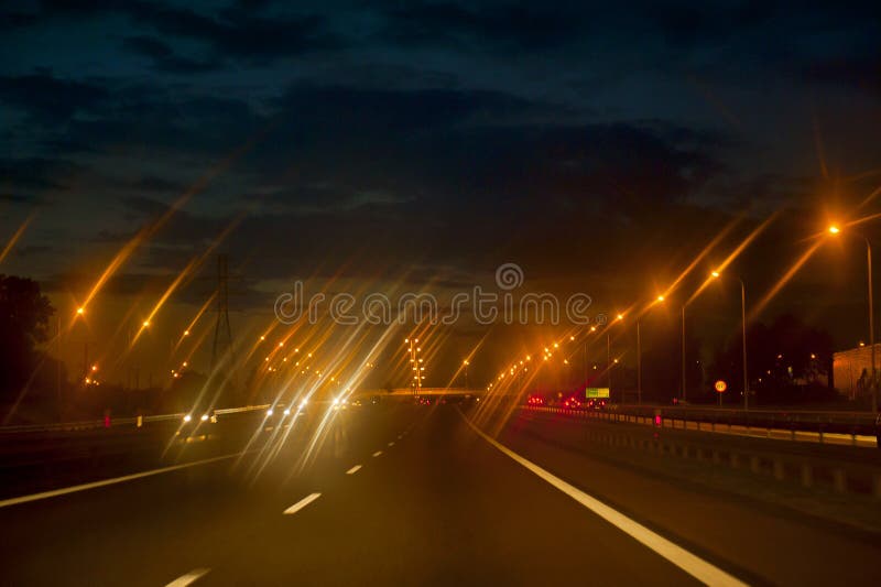 Driving at night stock image. Image of background, dusk - 142724815