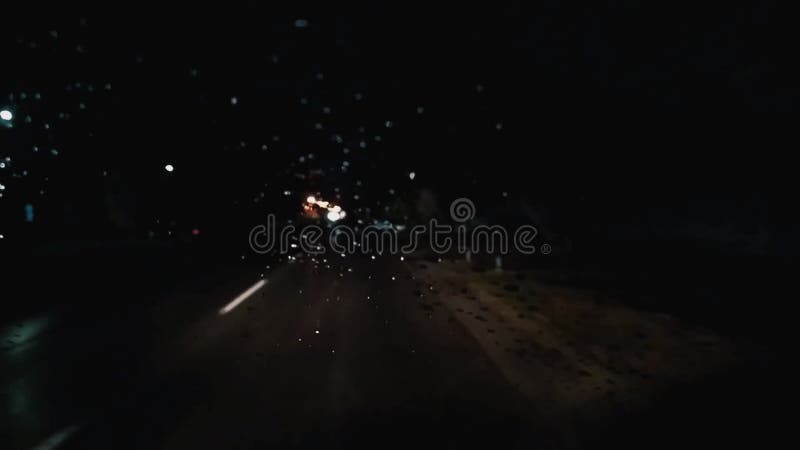 Driving at Night. Raindrops on the Windshield of the Car. Asphalt Road ...
