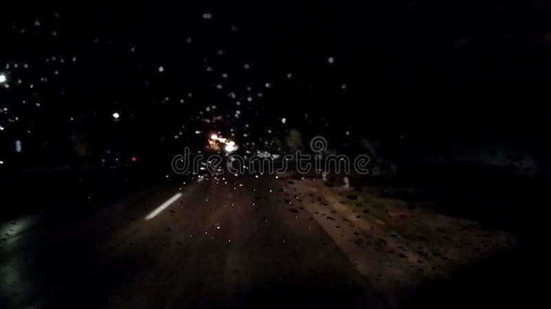 Driving at Night. Raindrops on the Windshield of the Car. Asphalt Road ...