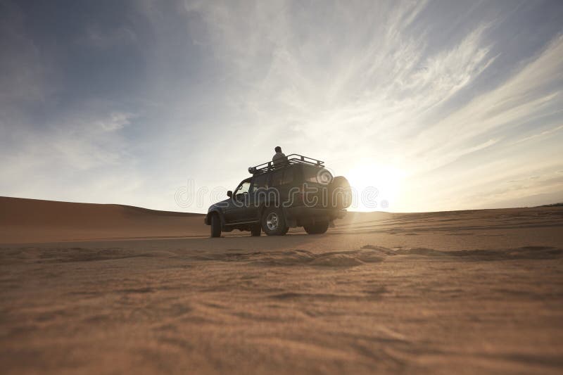 Driving Off Road at a Desert Stock Photo - Image of flare, journey ...