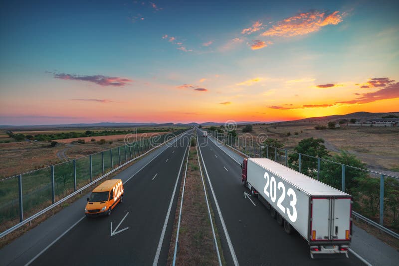 Driving on Open Road at Beautiful Sunset Toward Upcoming New Year 2023 ...
