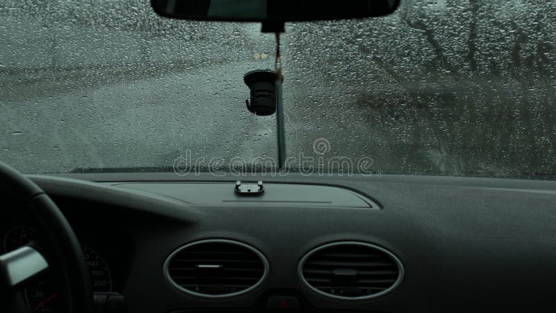 Driving in rainy weather stock photo. Image of street - 70850728