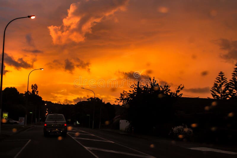 Dramatic sunset over road editorial photography. Image of pink - 121258457