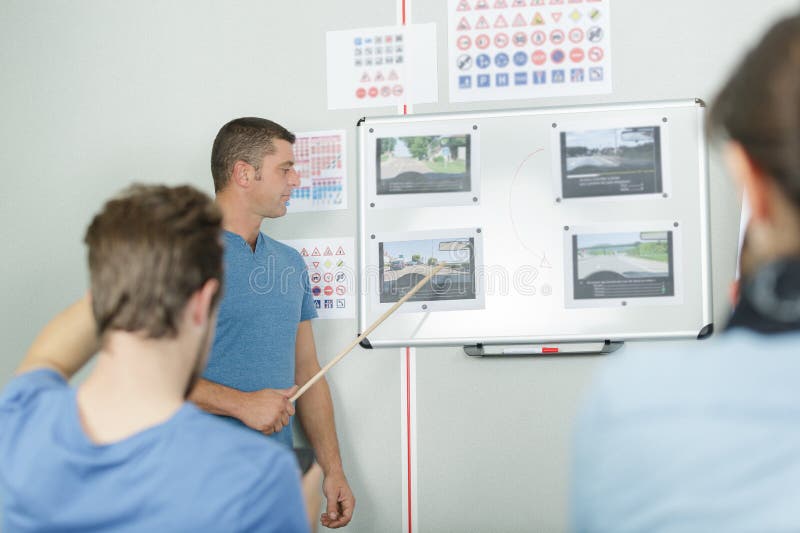 Driving School Teacher at Class Stock Photo - Image of ...