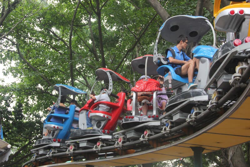 Driving a Small Roller Coaster of Tourists in Shenzhen Amusement Park ...