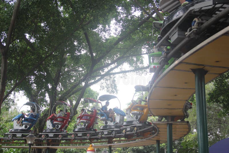 Driving A Small Roller Coaster Of Tourists In Shenzhen Amusement Park ...