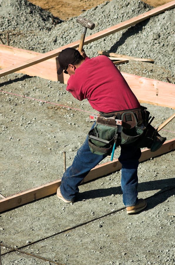 Driving Stakes stock image. Image of concrete, labor, employment - 1833843