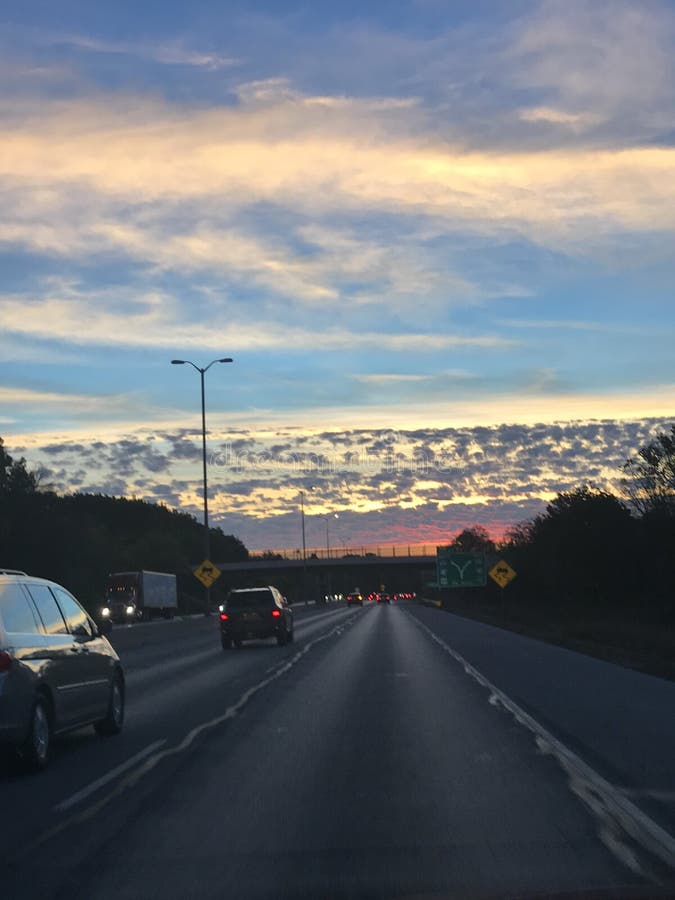 Driving into the sunset stock image. Image of sunset - 137695213