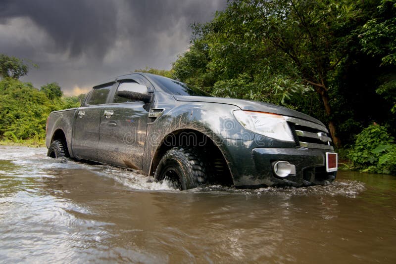 Driving a Test Car in a Stream in the Middle of a Forest in Thailand ...