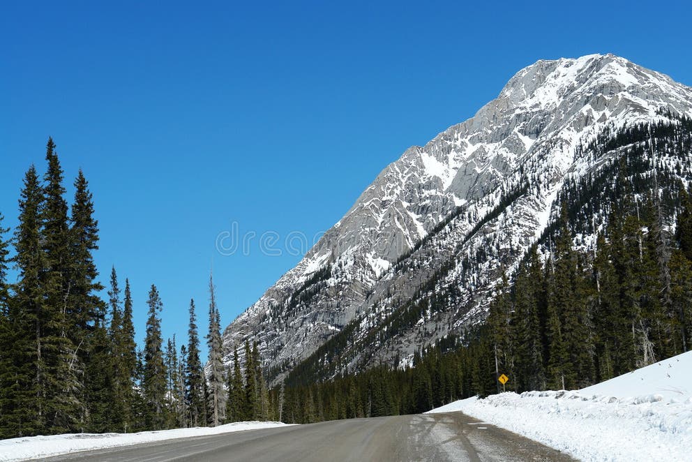 Driving in winter rockies stock image. Image of canadian - 4417975