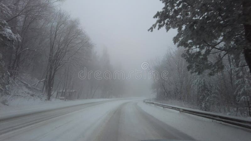 Driving Winter Snow Road. View through the Windshield on the Highway in ...