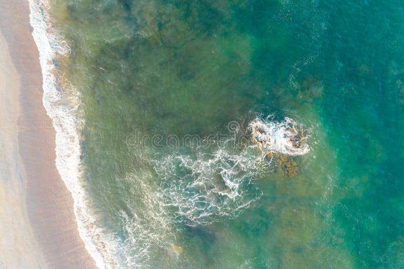 Drone Aerial Top View of a Beach Shore with a Rock in the Sea Stock ...