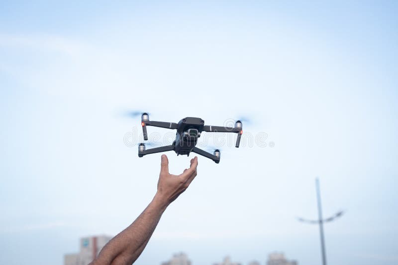 A Drone Being Collected after Shooting Aerial Footage Stock Photo ... A Drone Being Collected after Shooting Aerial Footage Stock Photo ...