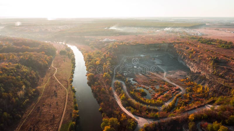 Drone with a Camera, Beautiful River through Career and Forest. C Stock ...
