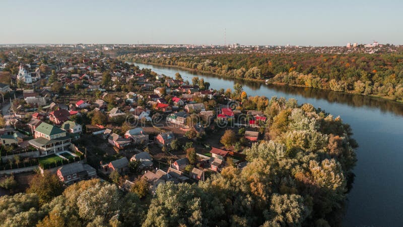 Drone with a Camera, Beautiful River through Houses and Forest Stock ...