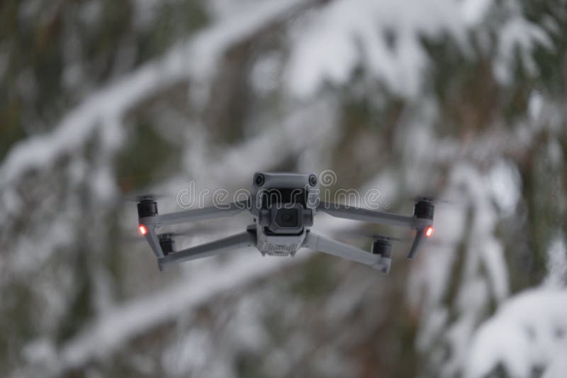 Drone with a Camera in Flight in the Forest in Winter, Close-up Photo ...