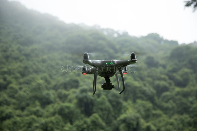Drone with Camera Flying Over Forest Stock Image - Image of flight ...