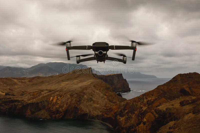 Drone with Camera Flying Over the Mountains. Stock Photo - Image of ...