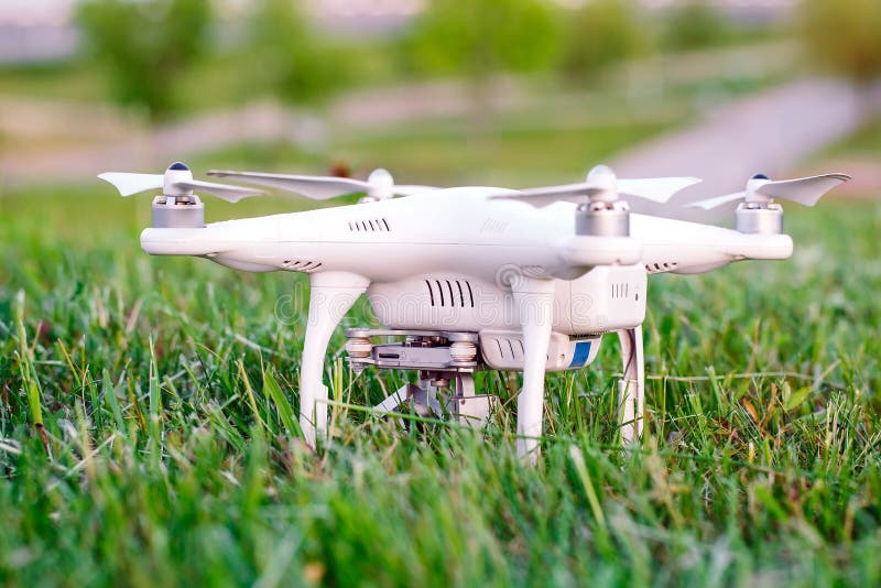 Drone with Camera in the Grass Preparing To Fly. Stock Photo - Image of ...