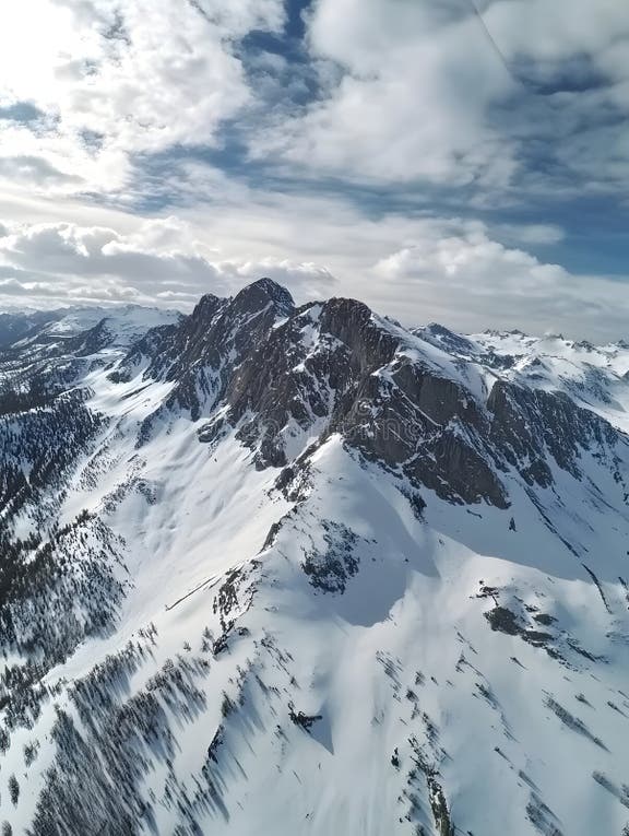 Drone Capture of a Breathtaking Mountain Range Covered in Snow, with ...