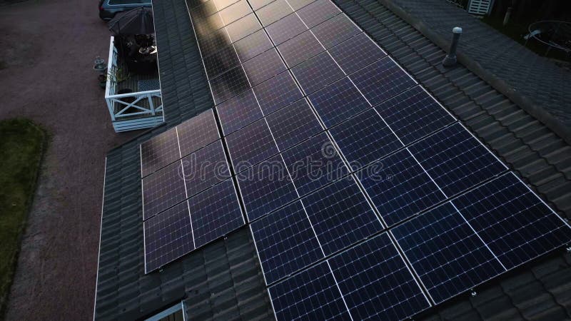 Sunset Sky Mirroring from a Rooftop Solar Array Modules - Aerial View ...