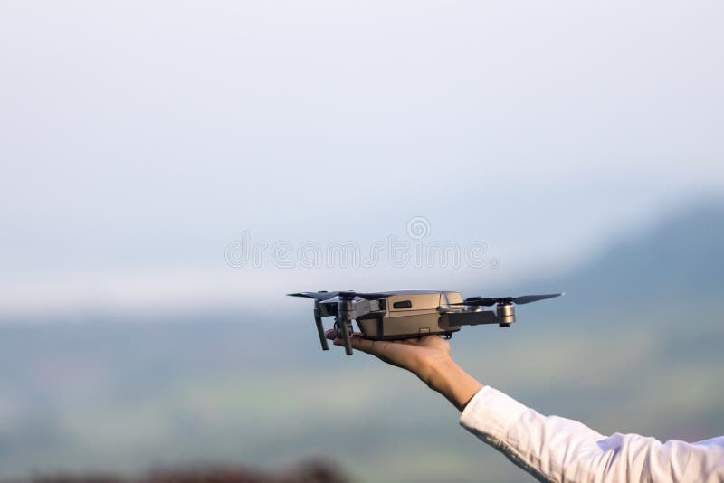 Drone Copter Flying with Digital Camera Near Hand. Stock Photo - Image ...