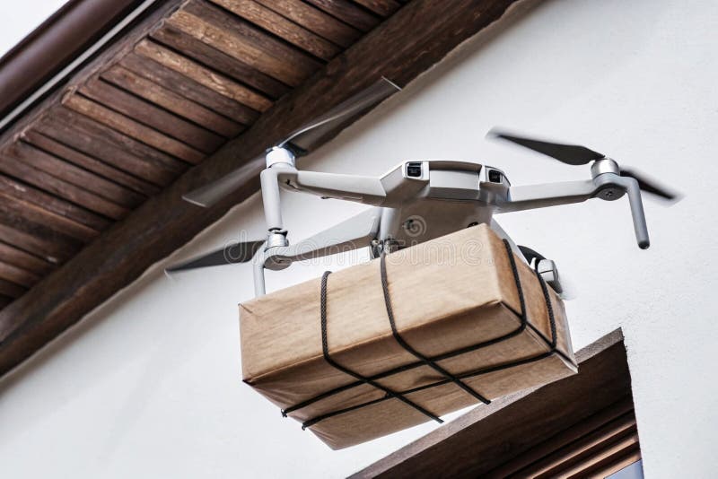 Drone Delivering a Package To a Building Modern Innovative Parcel ...