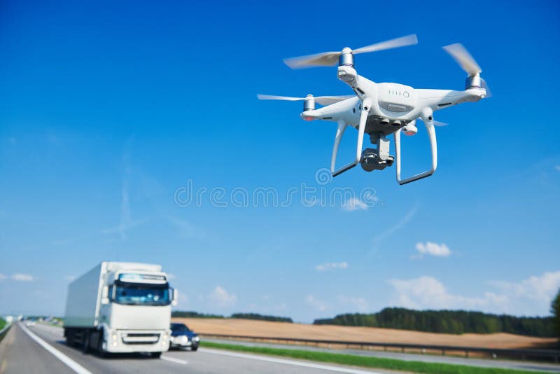 Drone and Transportation. Drone with Camera Controls Highway Road ...