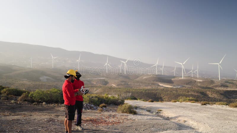Drone Engineers Working on Wind Turbine Farm Stock Footage - Video of ...