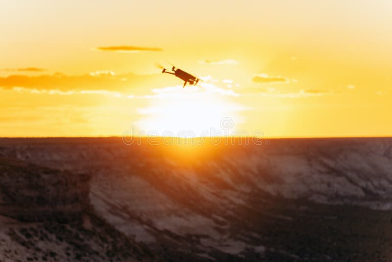 Drone in Epic Flight Against Dramatic Golden Sunset in Remote Location ...