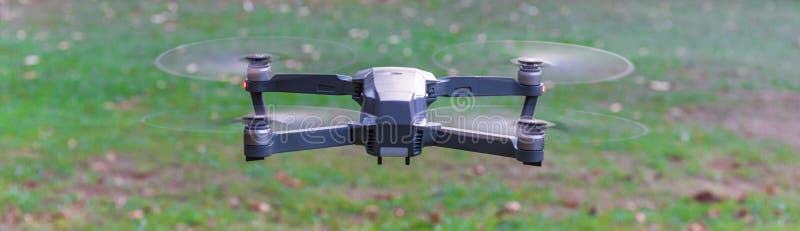 Drone on a Flying Above Grass Stock Image - Image of rotors, mavic ...
