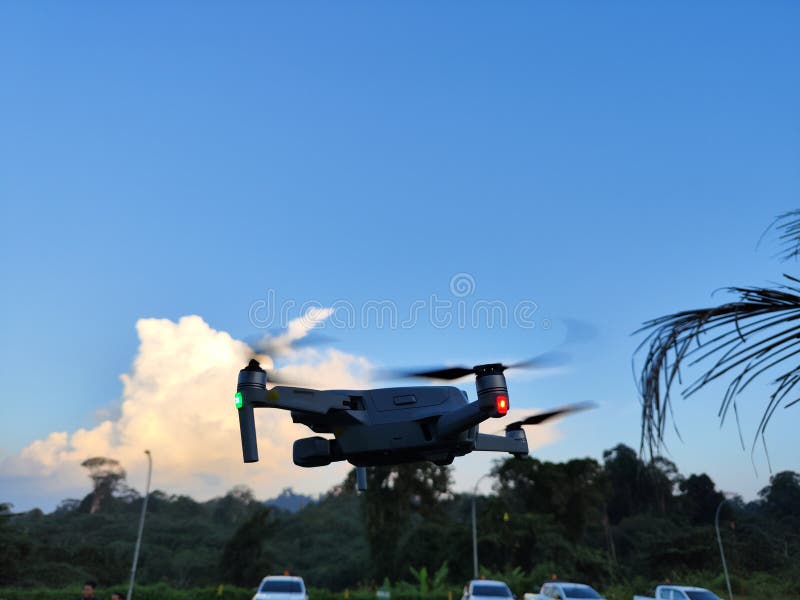 Drone Flying from a Distance Clouds in Background Stock Photo - Image ...