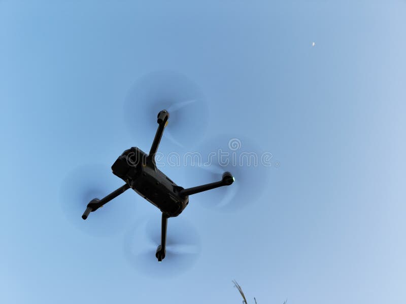 Drone Flying from a Distance Clouds in Background Stock Photo - Image ...