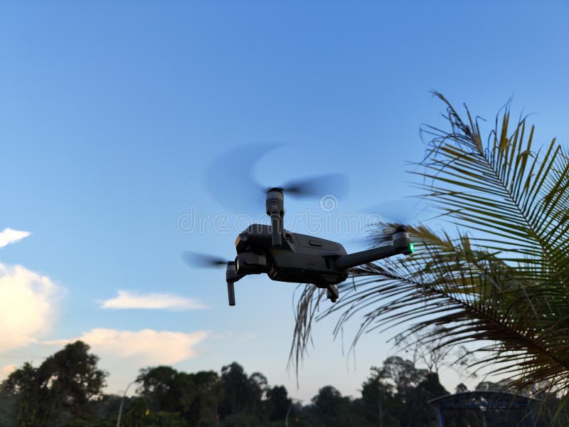 Drone Flying from a Distance Clouds in Background Stock Image - Image ...