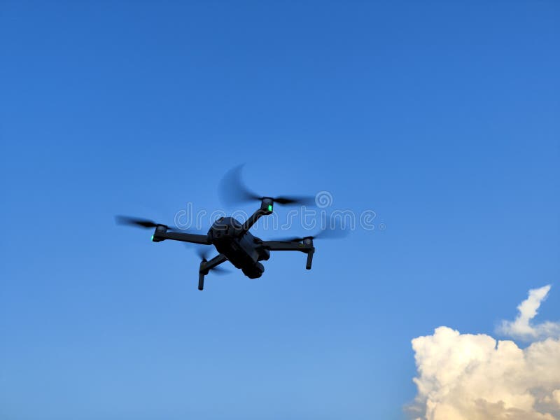 Drone Flying from a Distance Clouds in Background Stock Image - Image ...
