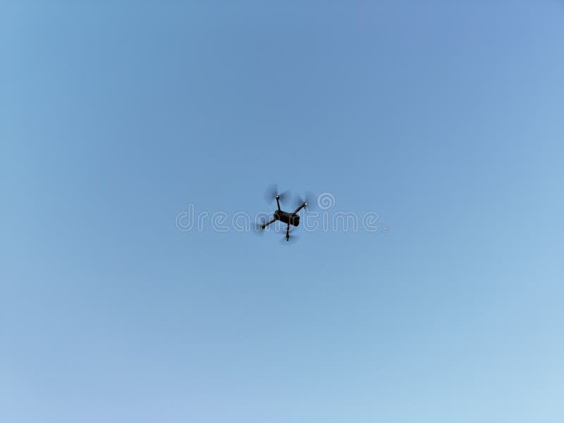 Drone Flying from a Distance Clouds in Background Stock Photo - Image ...