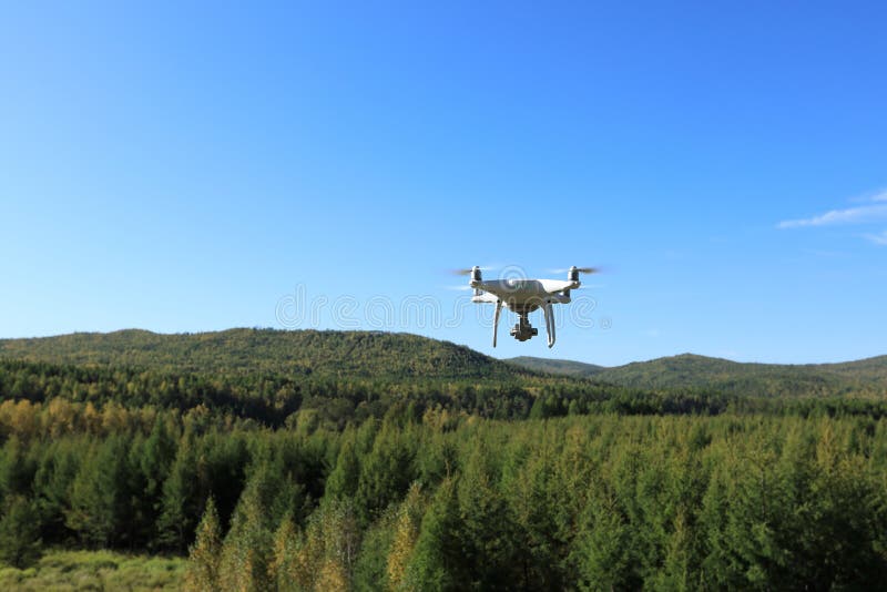 Drone flying in forest stock photo. Image of valley - 105430574