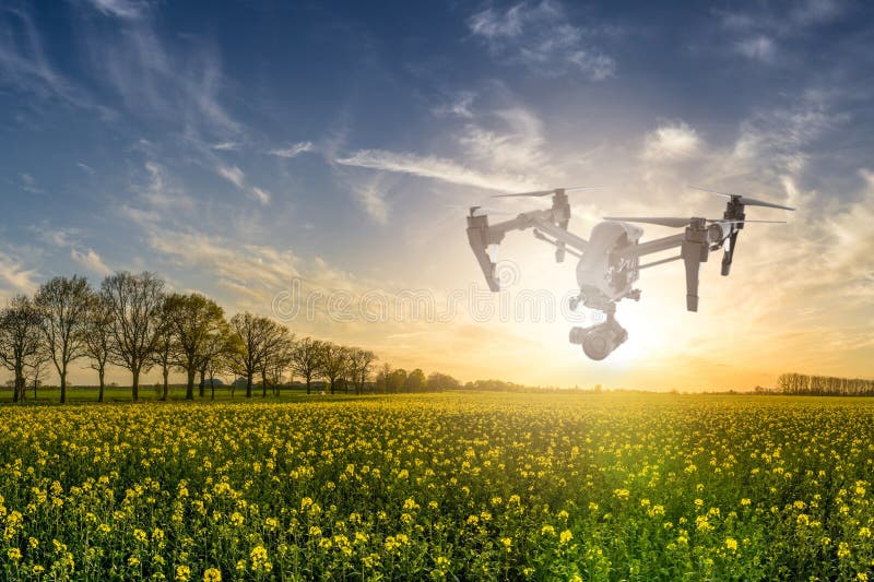 Drones Flying Over field stock photo. Image of outdoors - 151000790