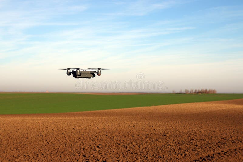 The Drone is Flying Over the Field Stock Photo - Image of flying ...