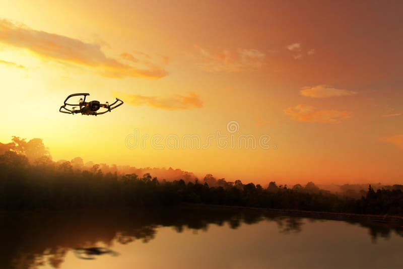 Drone Flying Overhead in Cloudy Sunset Sky Stock Photo - Image of ...