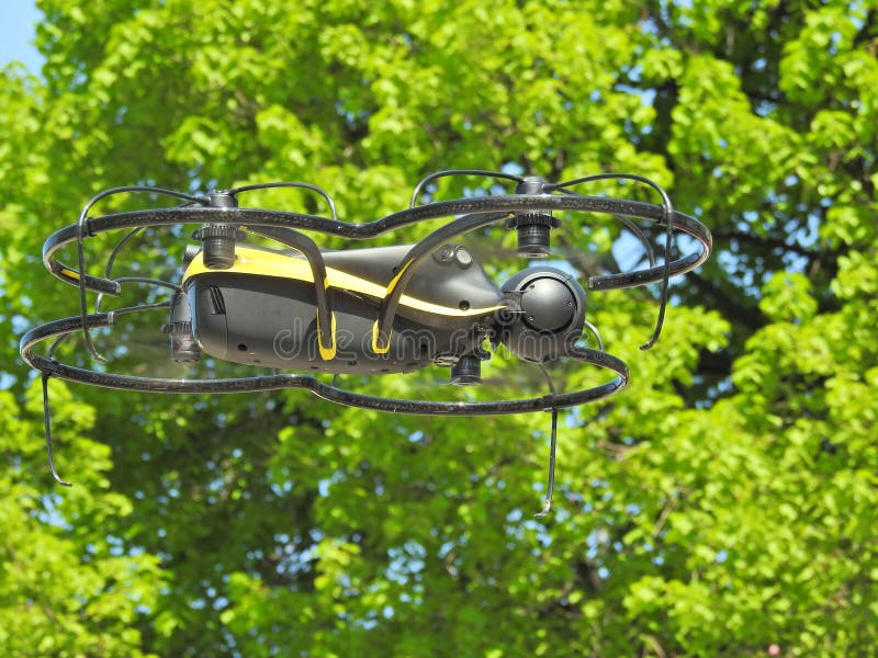 Drone flying among trees stock photo. Image of angle - 257121512