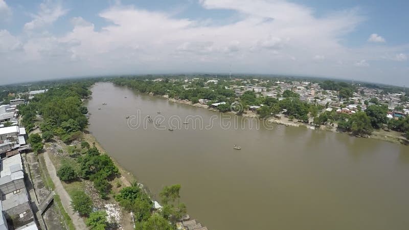 Drone Footage Over a Mountainside City with Buildings Overlooking a ...
