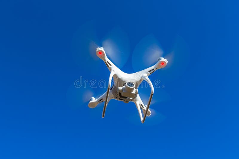Drone in front of blue sky stock photo. Image of surveillance - 126316120