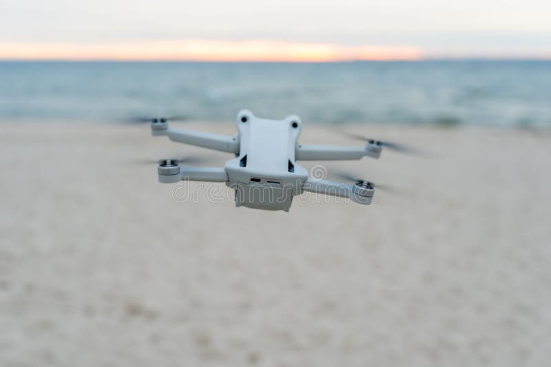 Drone Hovering on the Beach Stock Image - Image of water, drone: 268083493