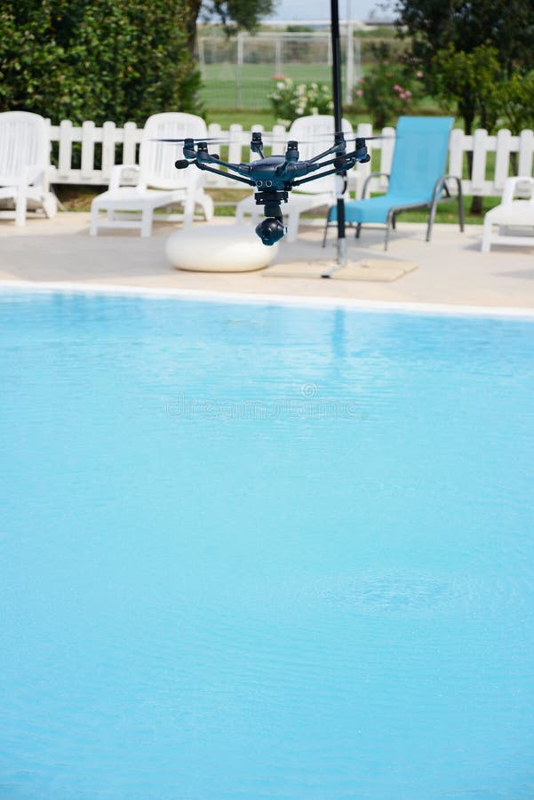 Drone Hovering Over Swimming Pool Stock Image - Image of horizontal ...
